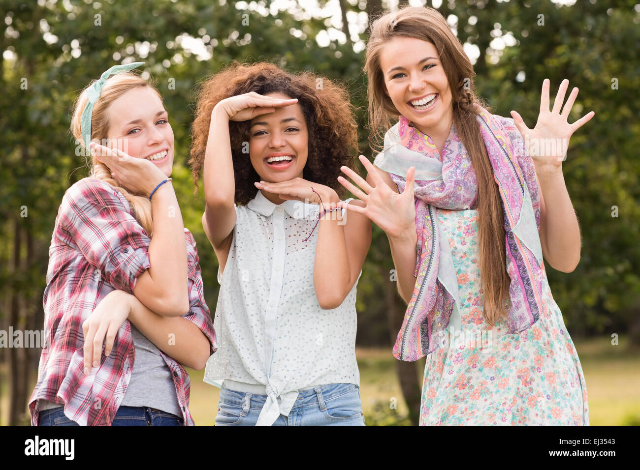 Happy friends in the park Stock Photo - Alamy