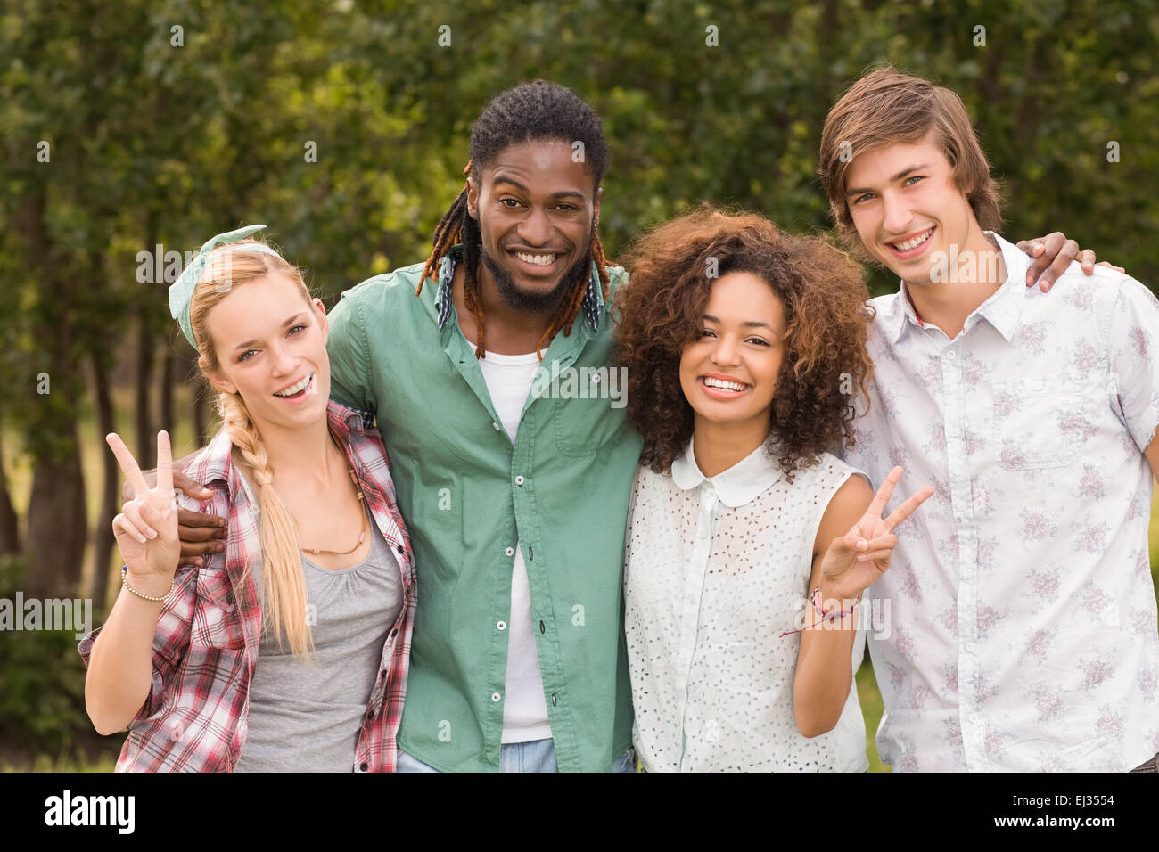 Happy friends in the park Stock Photo - Alamy