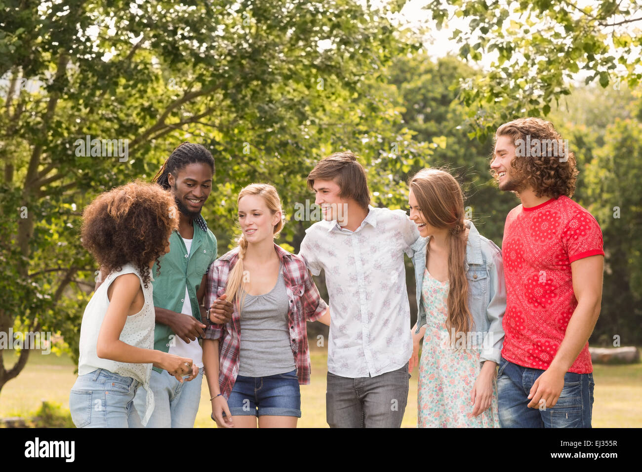 Happy friends in the park Stock Photo - Alamy