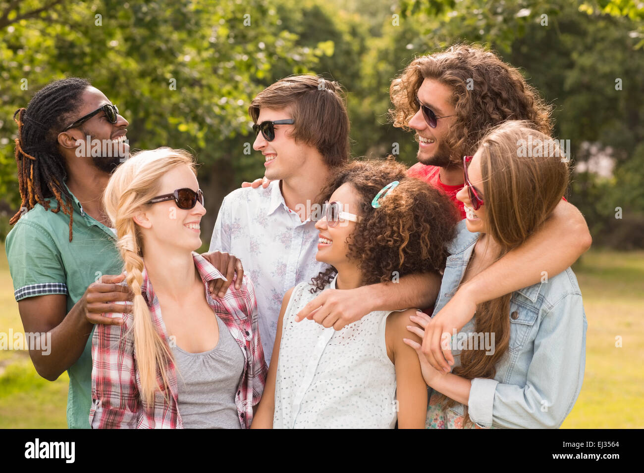 Happy friends in the park Stock Photo - Alamy