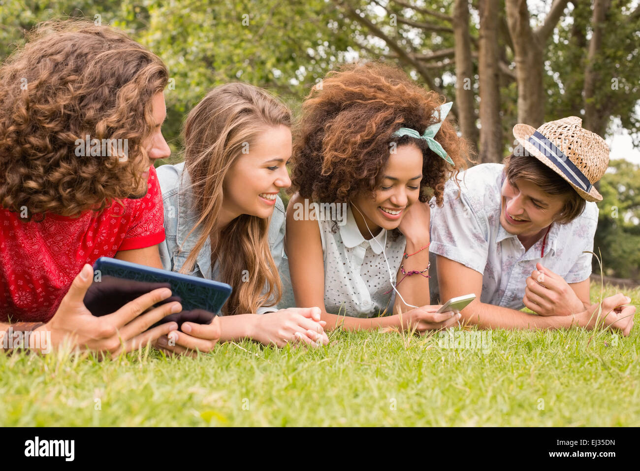 Happy friends in the park Stock Photo - Alamy