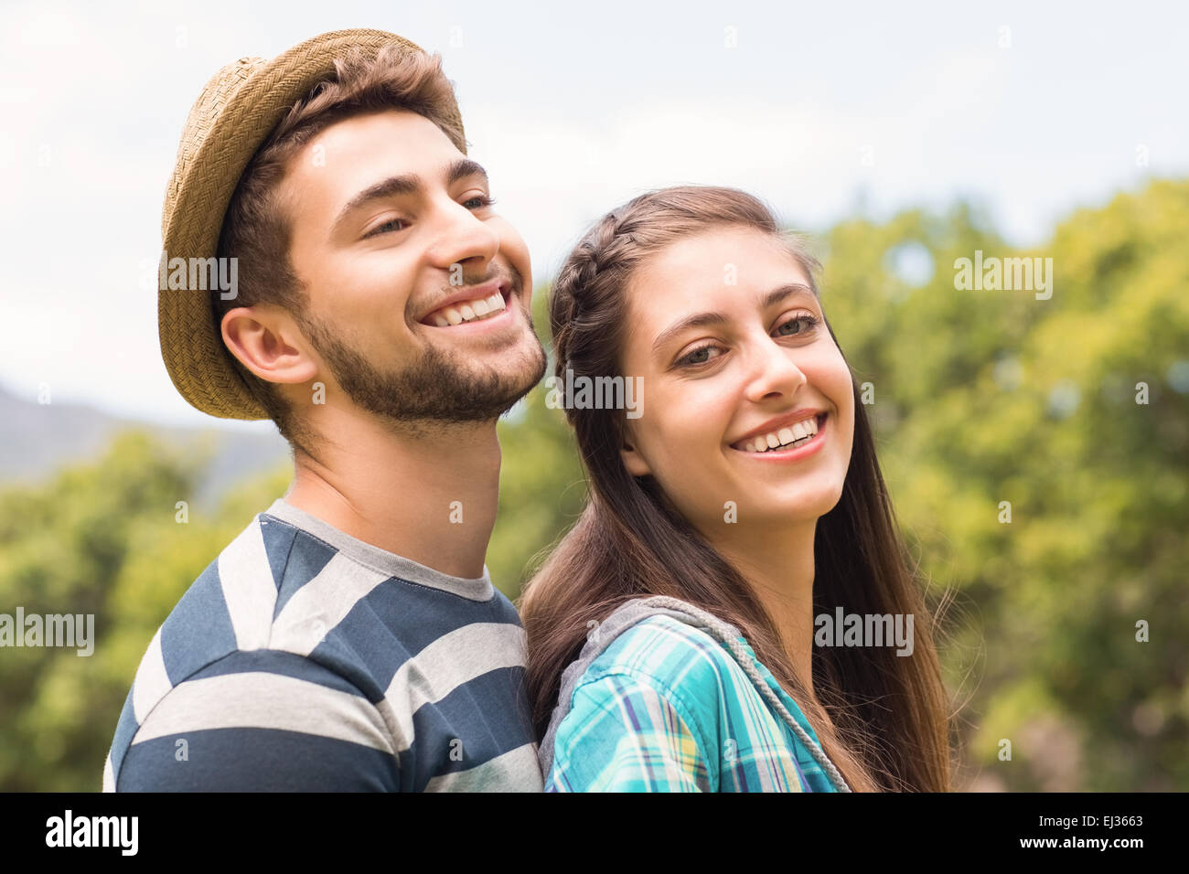 Young couple hugging in the park Stock Photo - Alamy