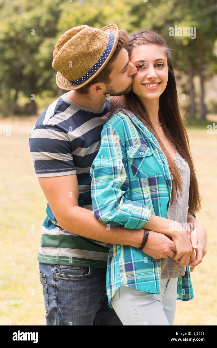 Young couple hugging in the park Stock Photo - Alamy