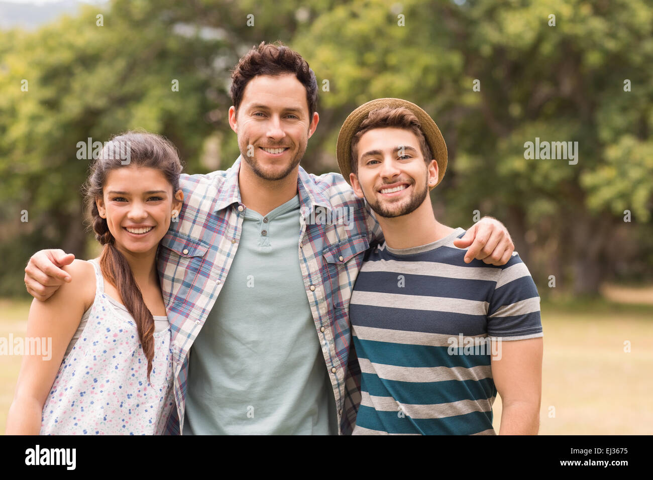Happy friends in the park Stock Photo - Alamy