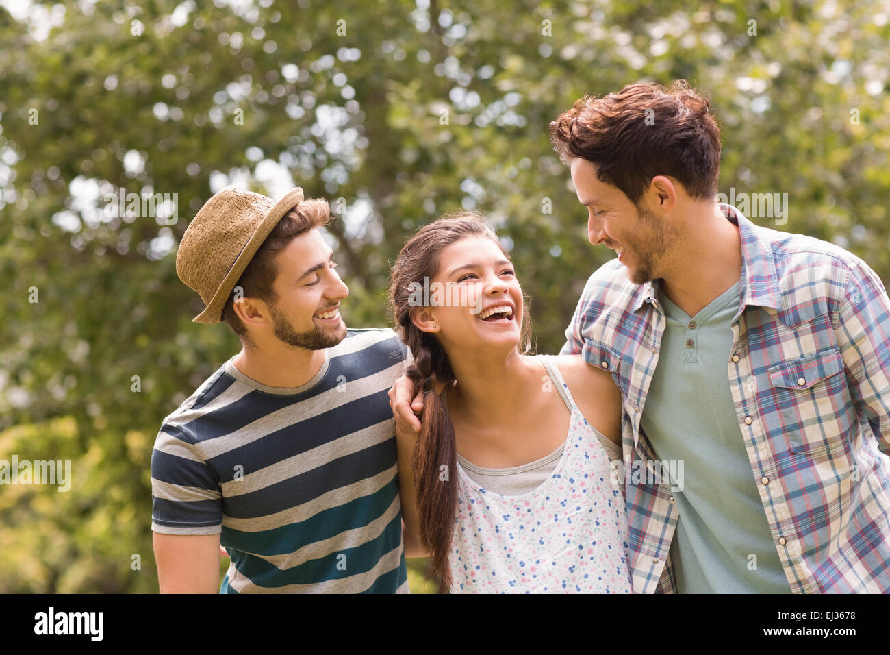 Happy friends in the park Stock Photo - Alamy