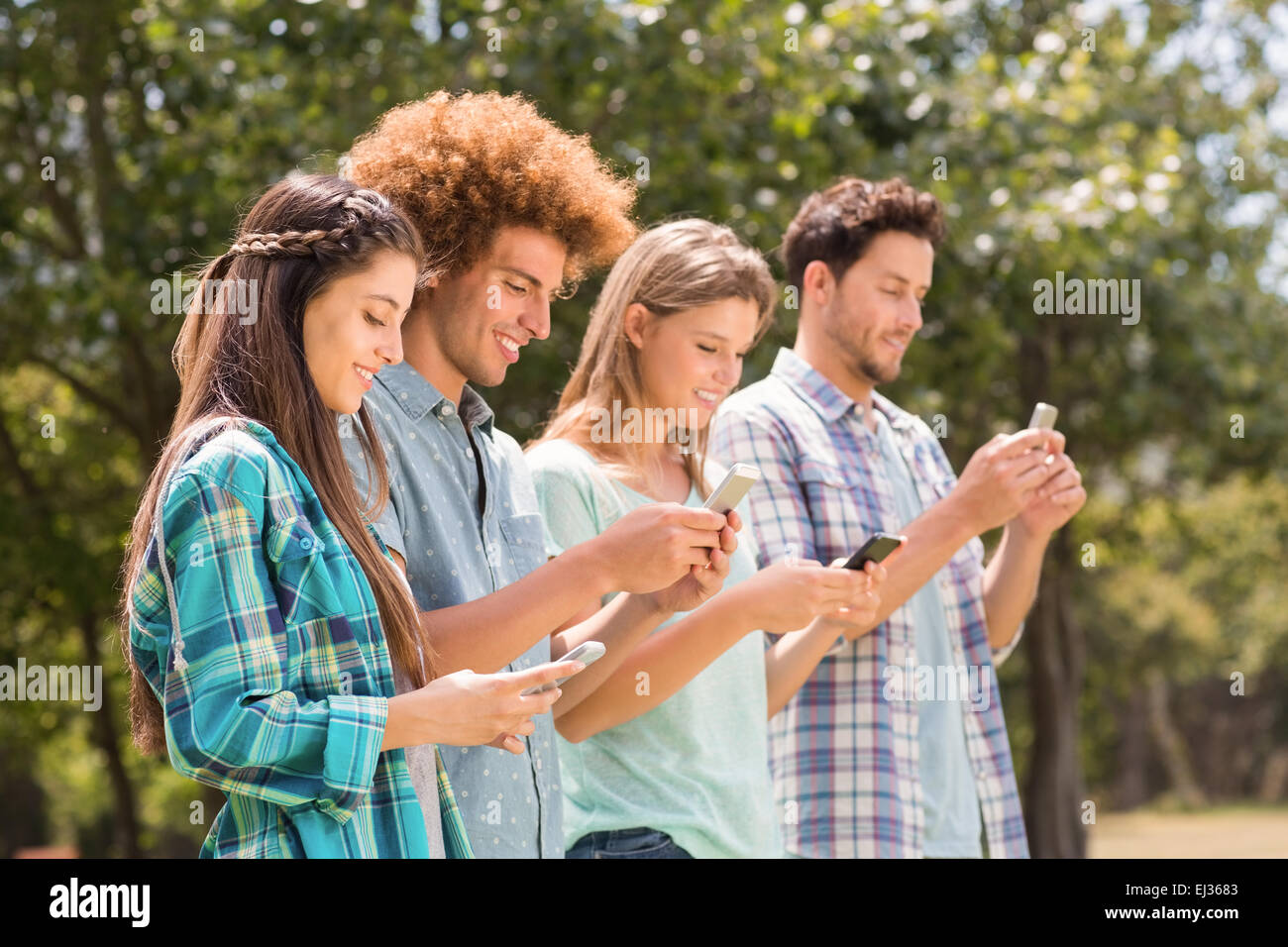 Happy friends in the park Stock Photo - Alamy