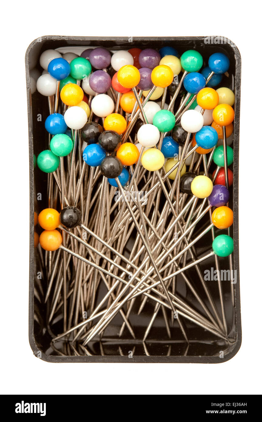 Box full of sewing needles on a white background Stock Photo - Alamy