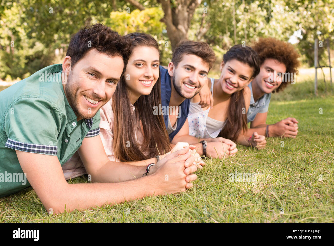 Happy friends in the park Stock Photo - Alamy