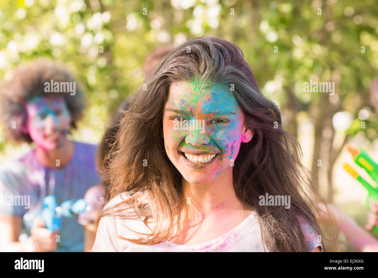 Happy girl covered in powder paint Stock Photo - Alamy