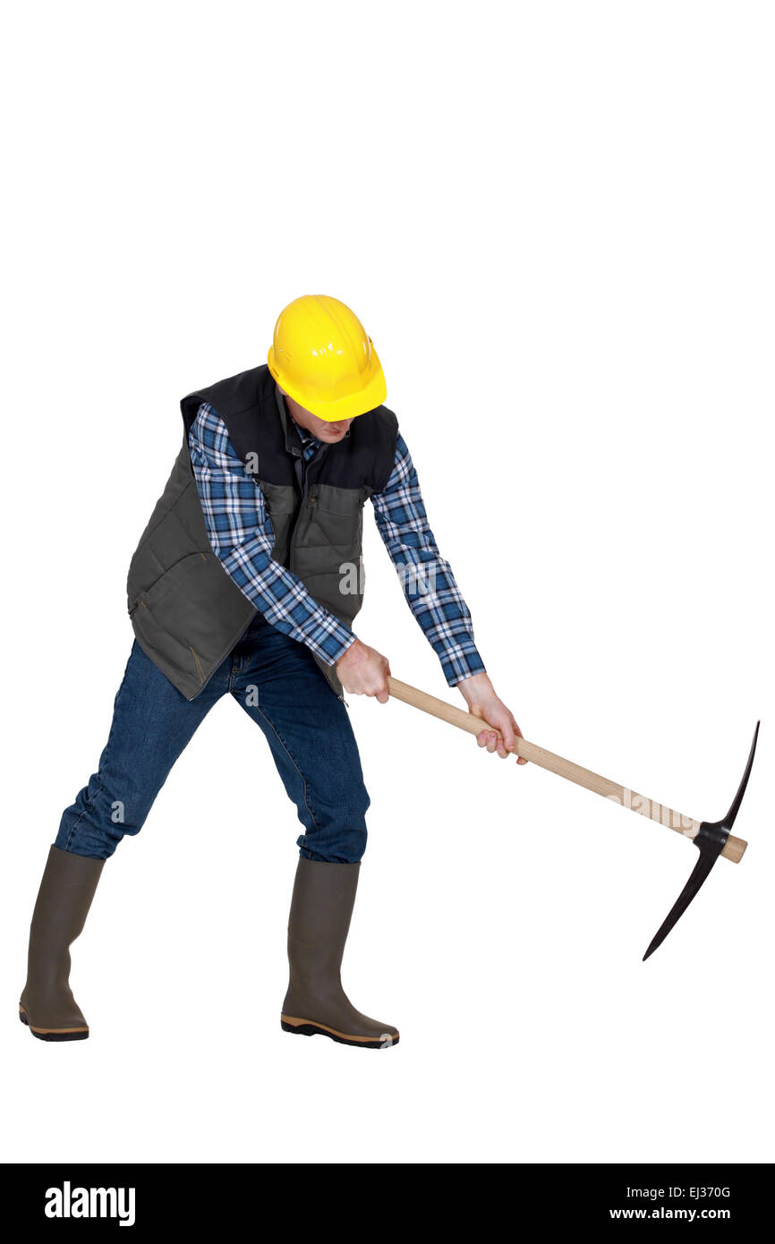 Man with a pickaxe Stock Photo - Alamy