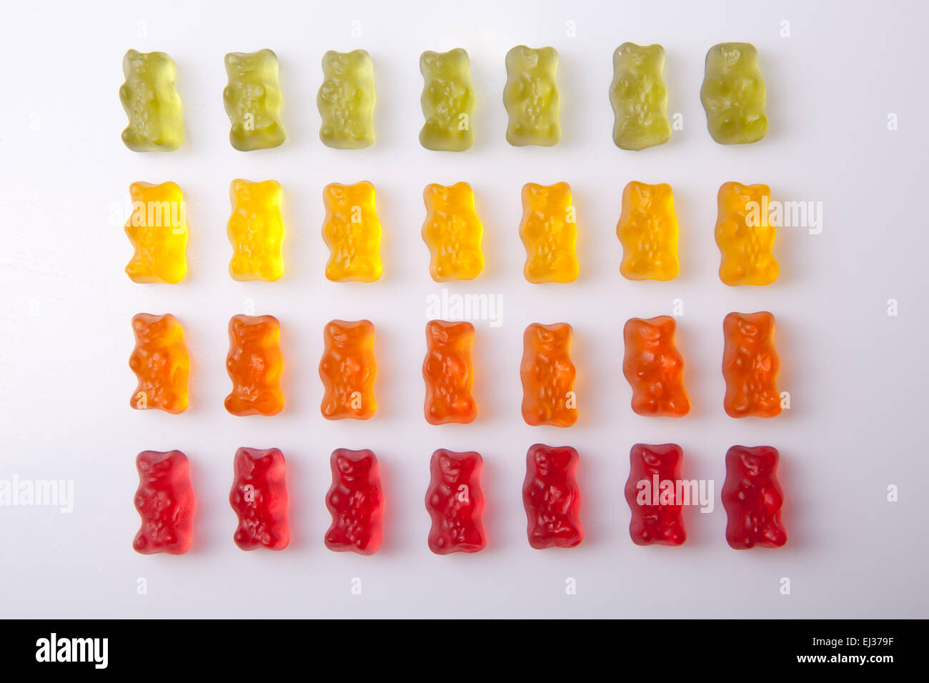 Rows of colorful gummy bears isolated over white background Stock Photo ...