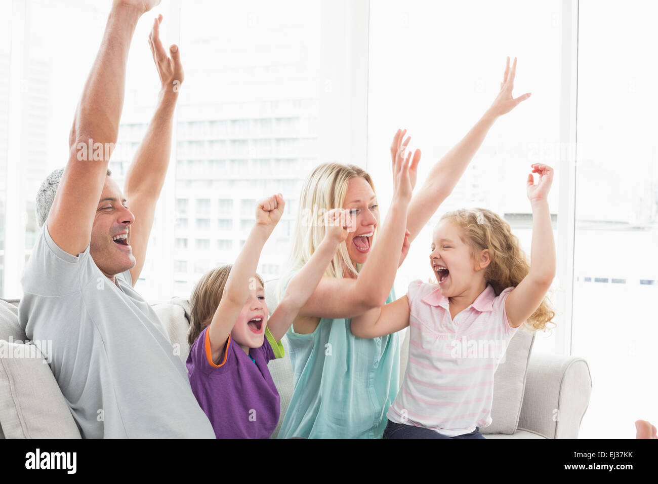 Family celebrating together watching hi-res stock photography and ...