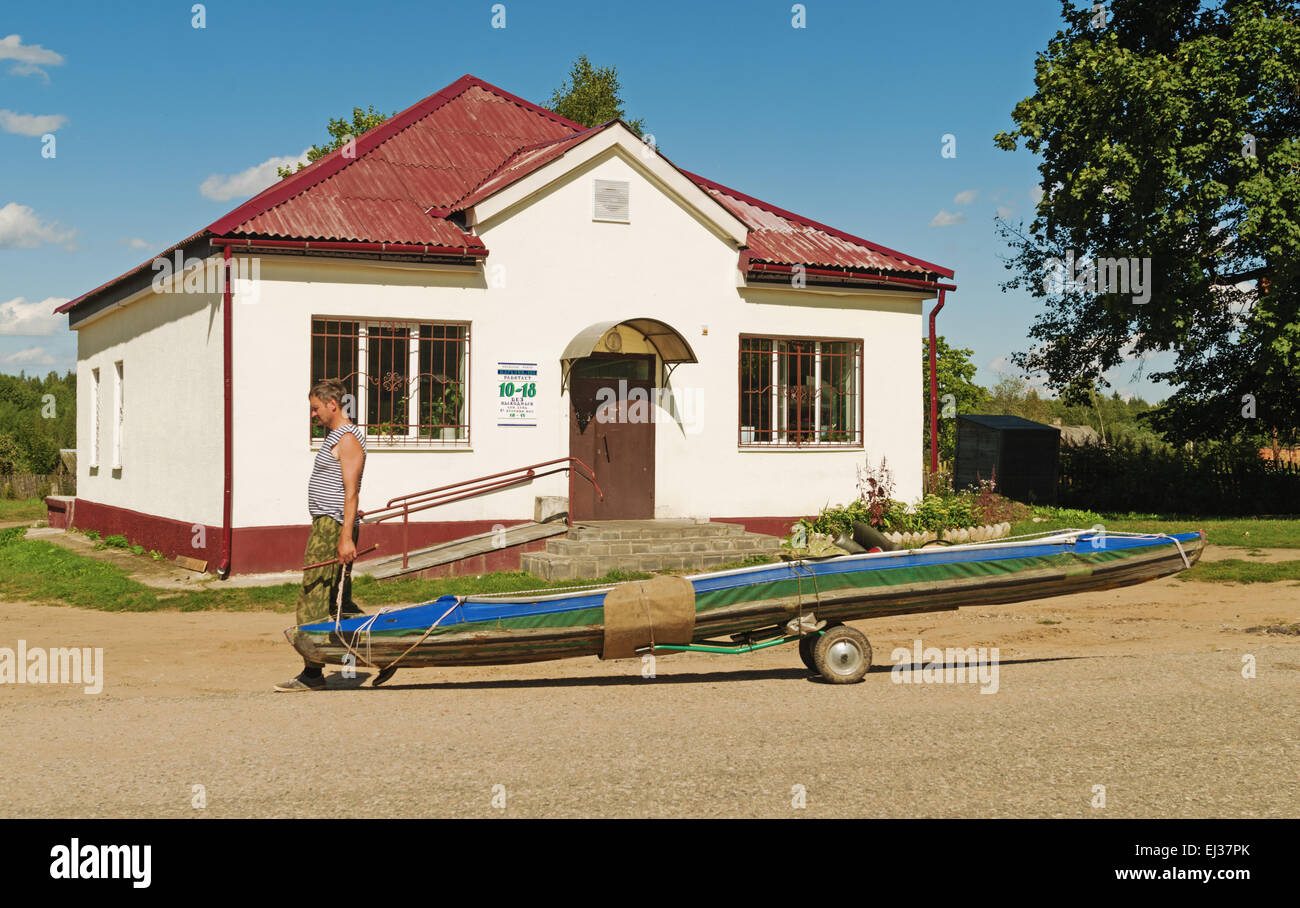 Canoe transportation on the cart on the road to the lake Stock Photo ...
