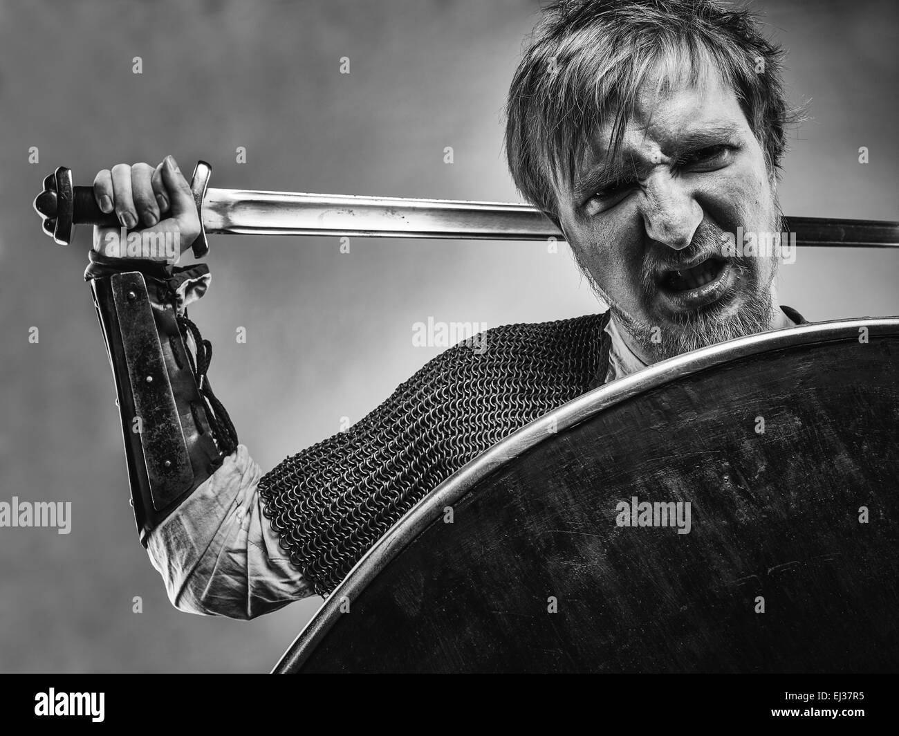 Angry medieval knight armor with a sword and shield, black and white ...