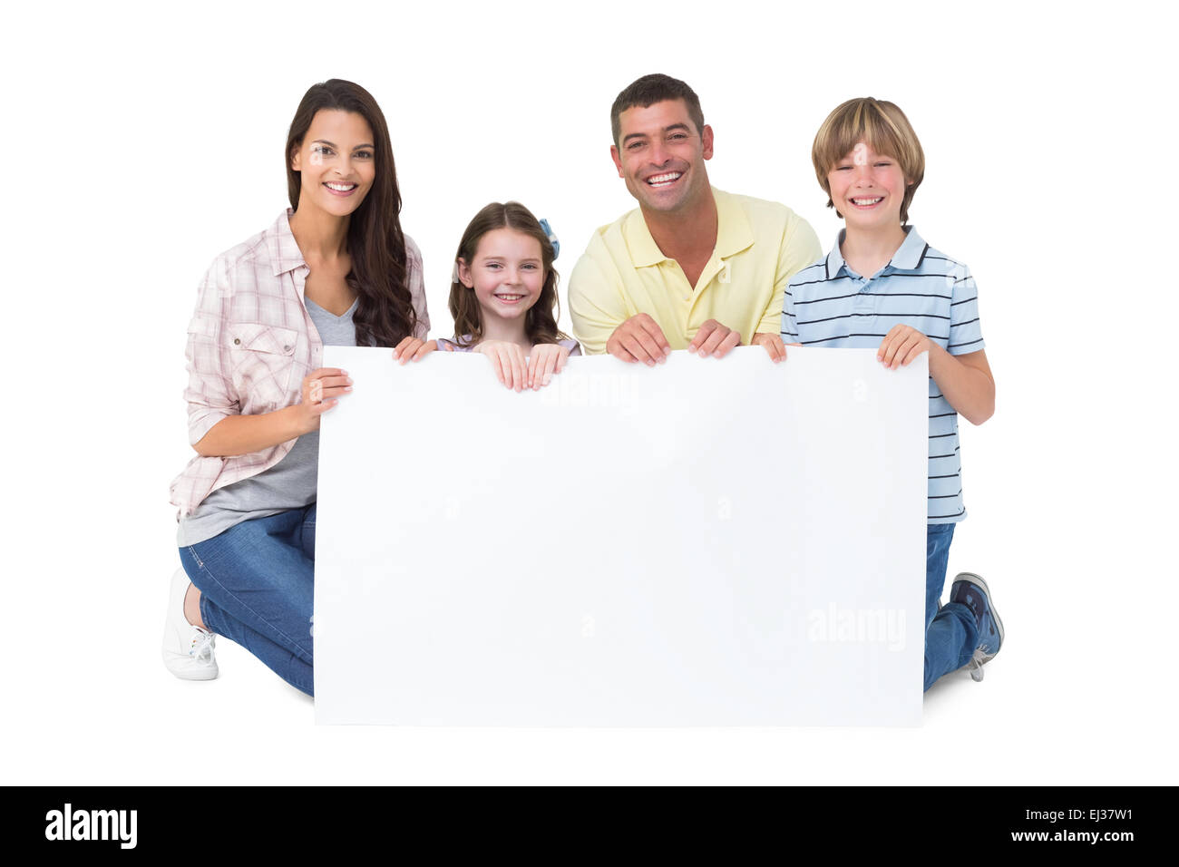 Happy family holding billboard over white background Stock Photo - Alamy