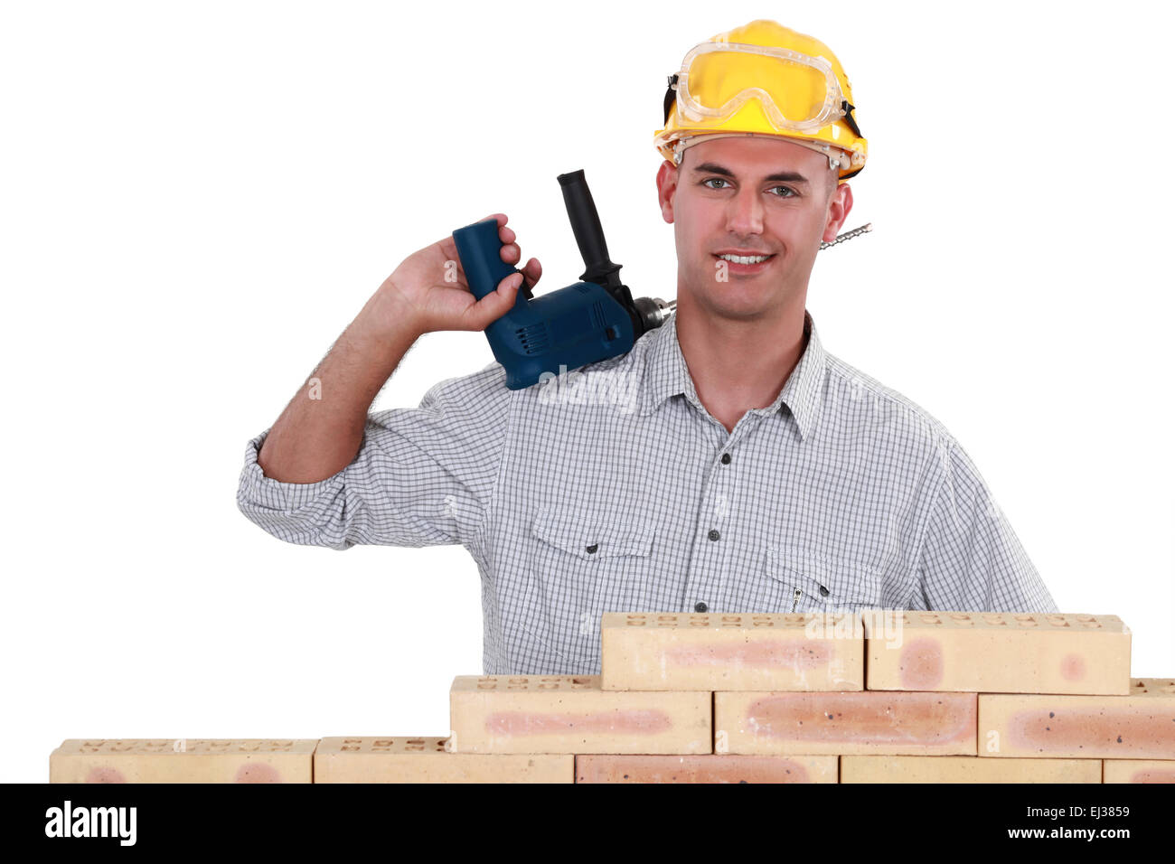A mason with a drill Stock Photo - Alamy