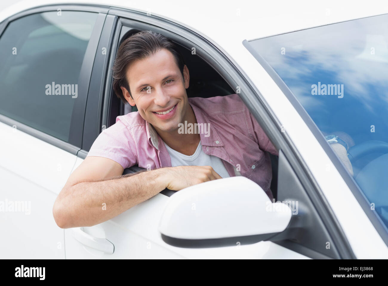 Man driving and smiling Stock Photo - Alamy