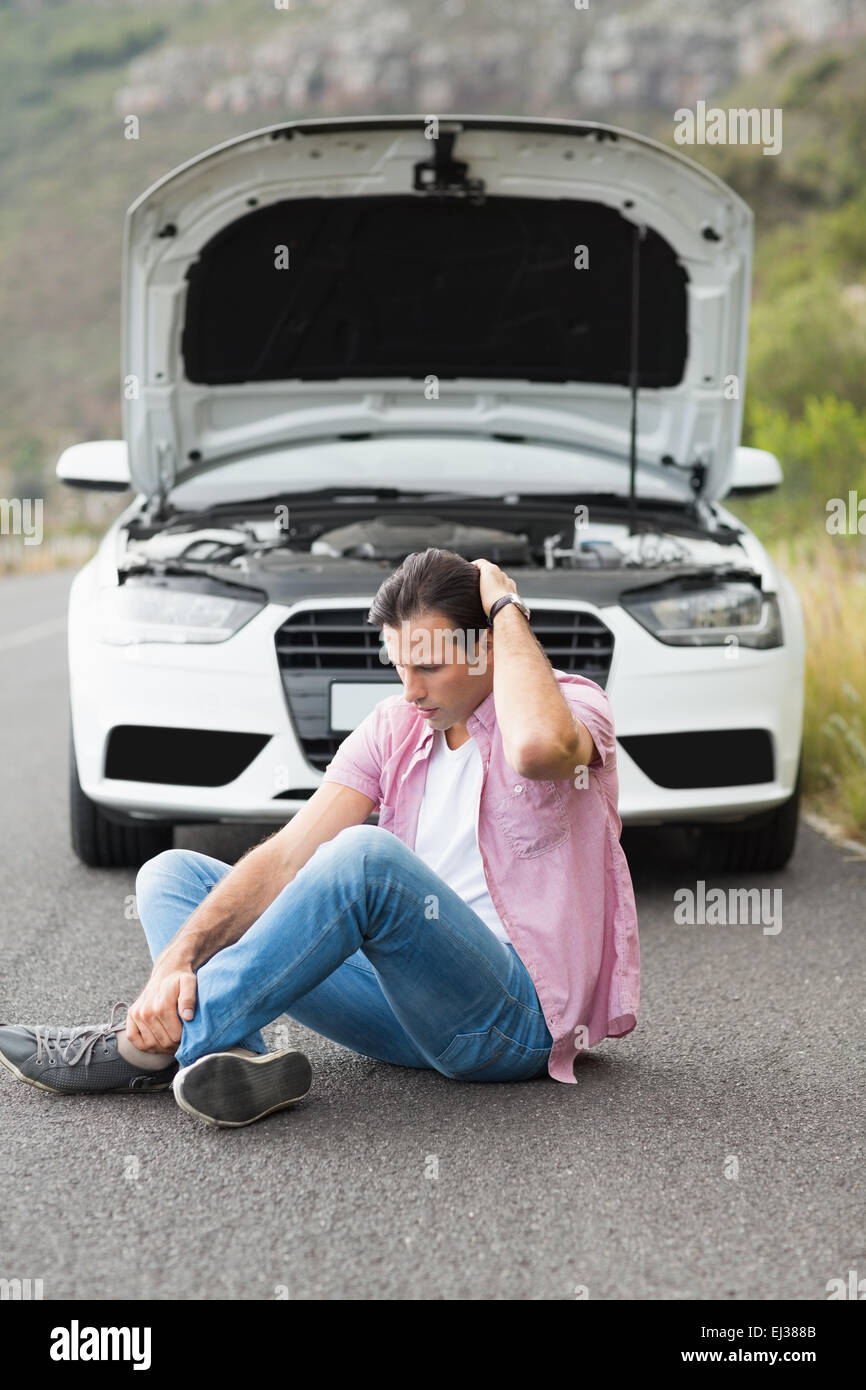 Stressed man sitting hi-res stock photography and images - Alamy