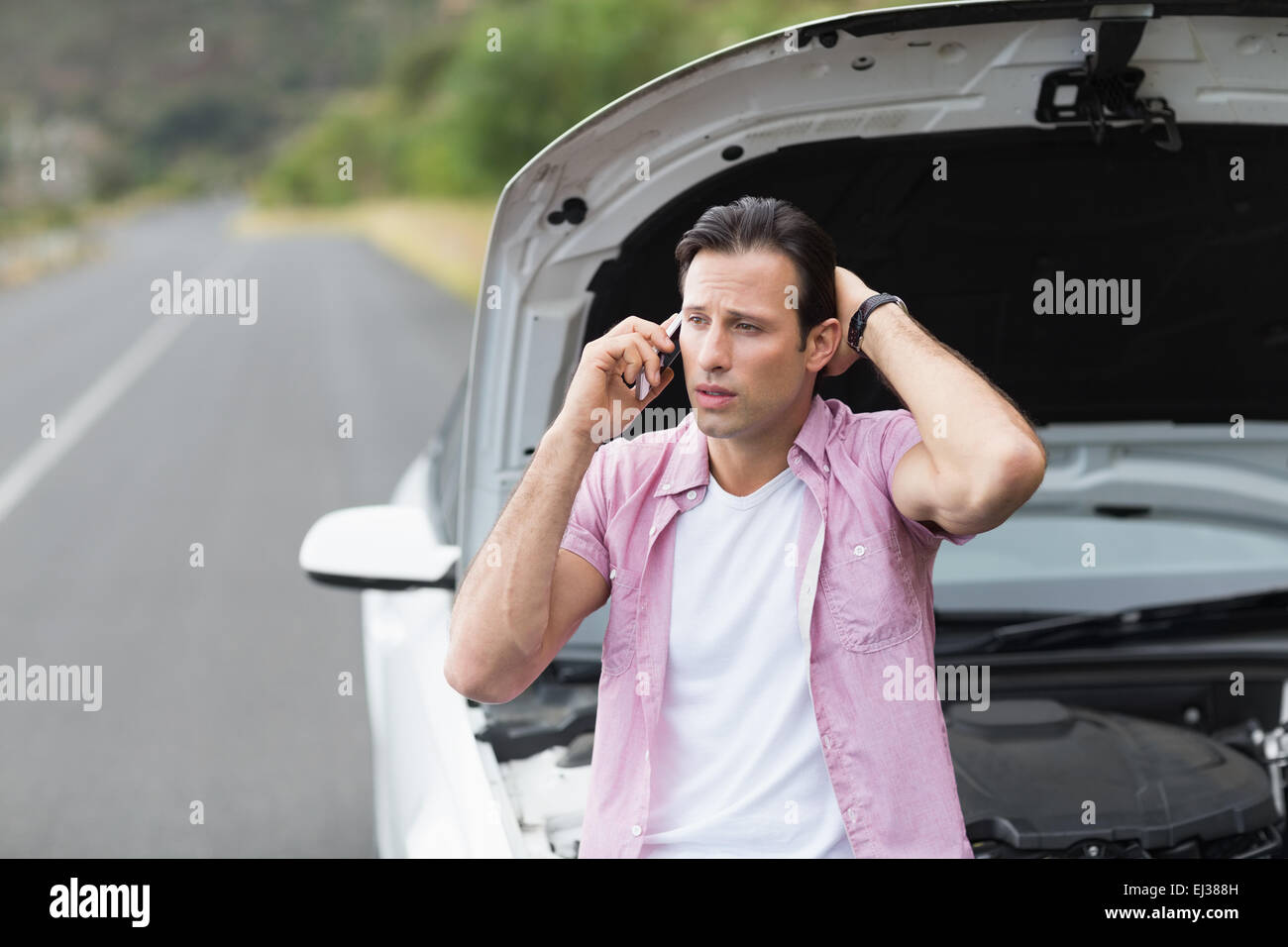 Man after a car breakdown Stock Photo - Alamy