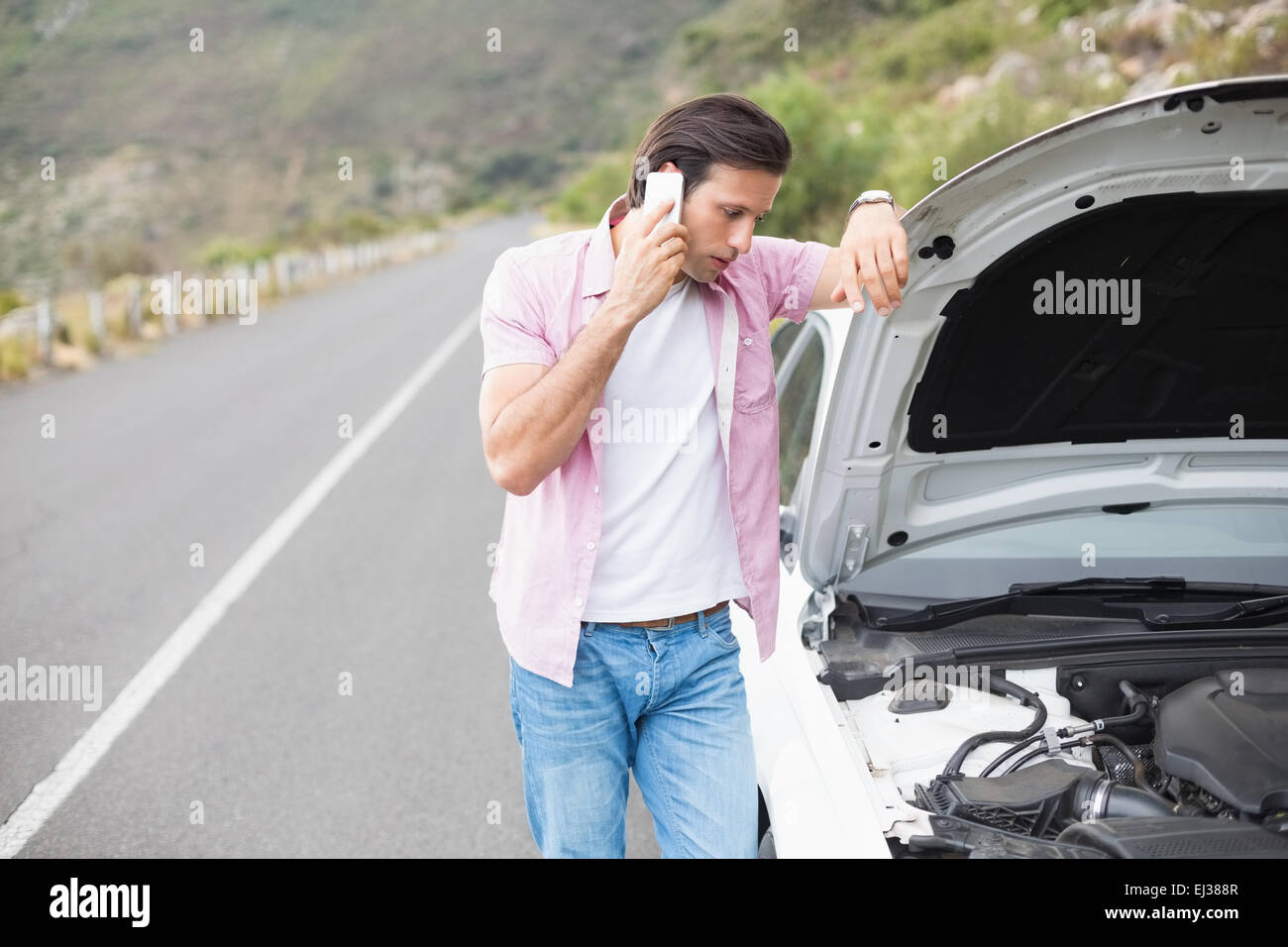 Man after a car breakdown Stock Photo - Alamy