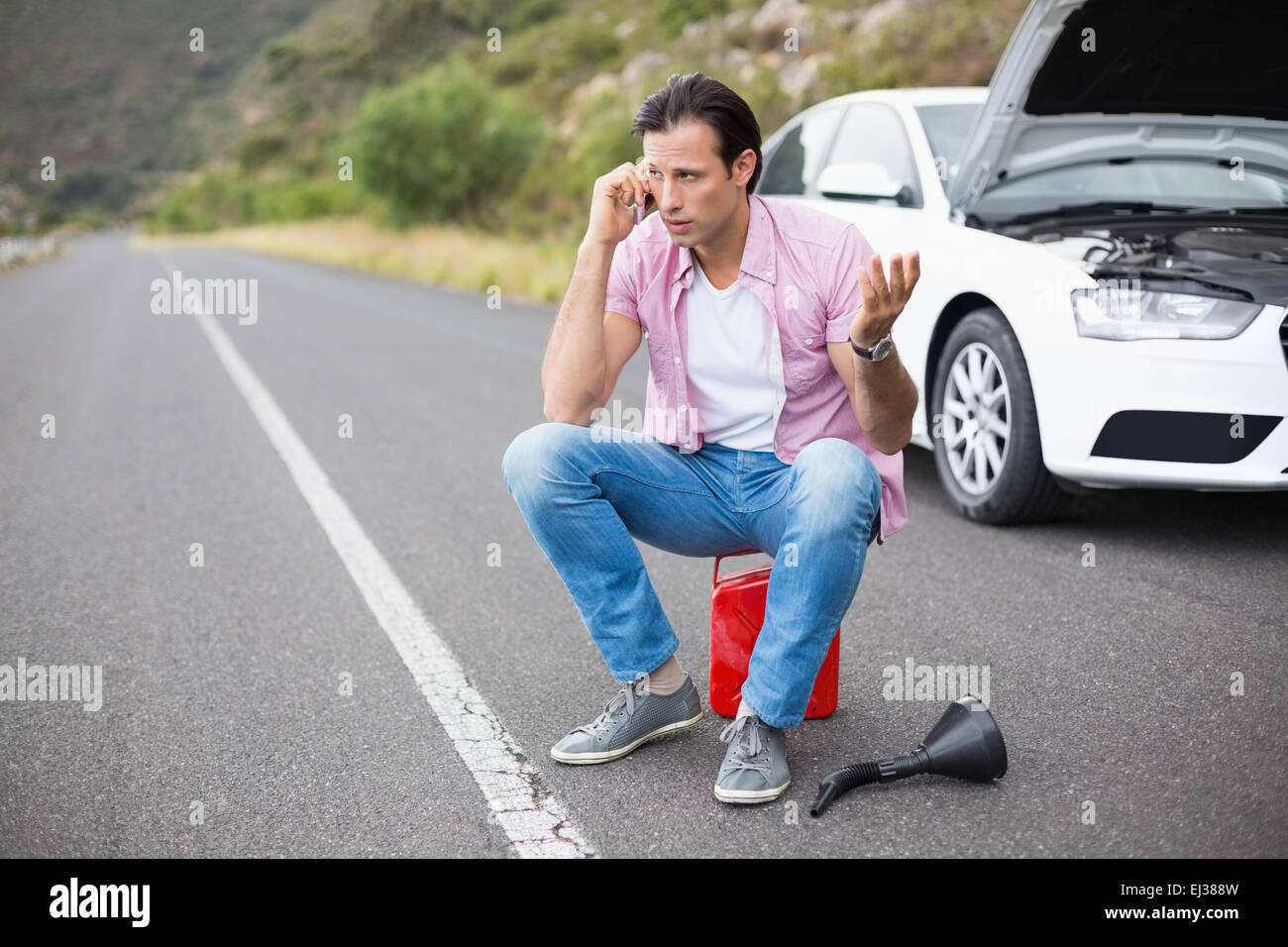 Man after a car breakdown Stock Photo - Alamy
