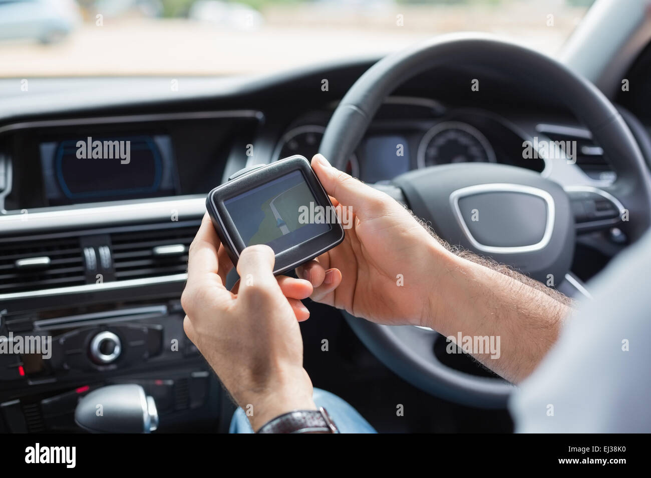 Man using satellite navigation system Stock Photo - Alamy