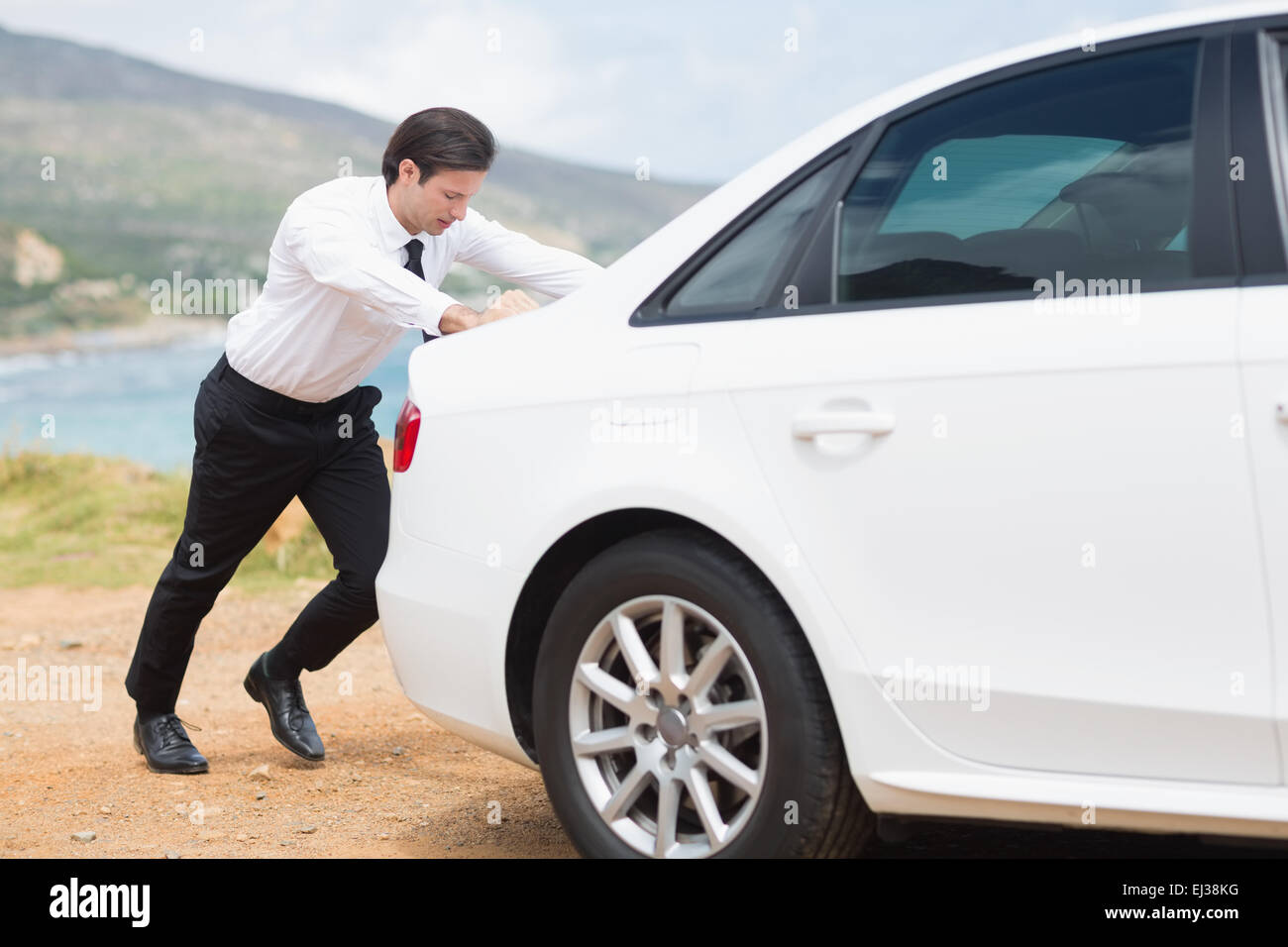 Pushing car hi-res stock photography and images - Alamy