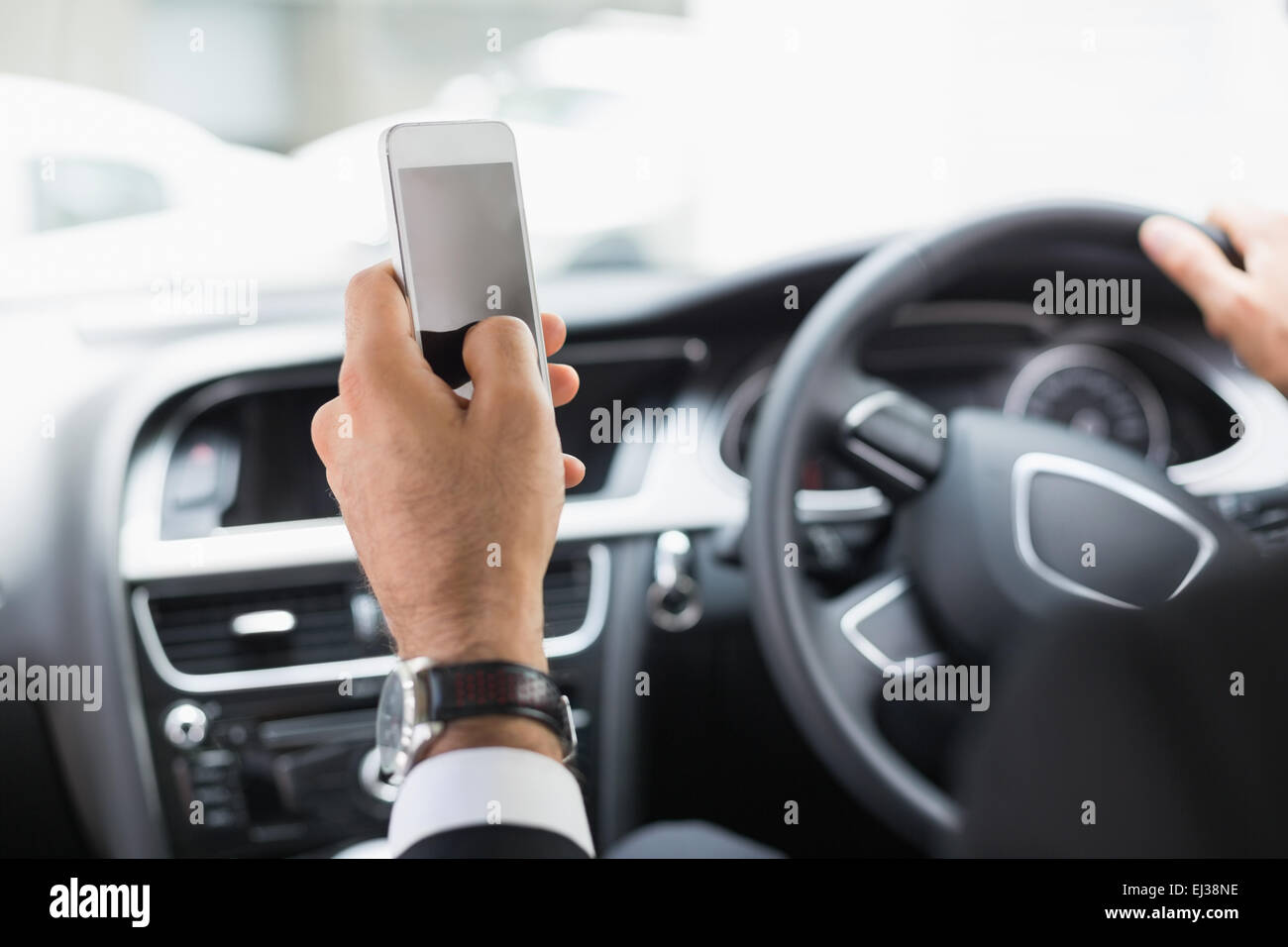 Businessman sending a text message Stock Photo - Alamy