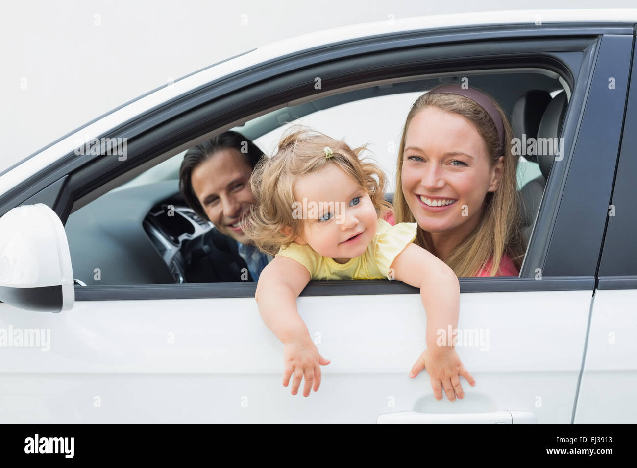 Parents and baby on a drive Stock Photo - Alamy