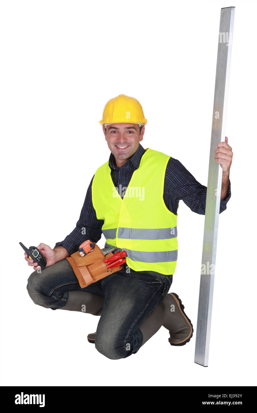 Craftsman with a radio and metal ruler Stock Photo - Alamy
