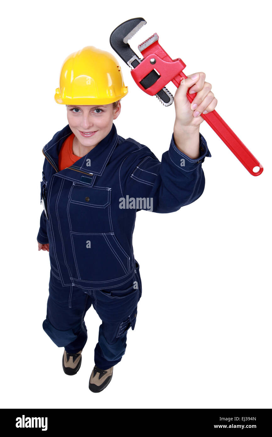 Female worker with an adjustable pipe wrench Stock Photo - Alamy