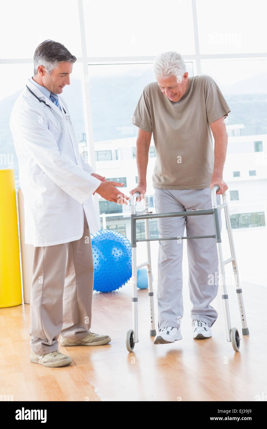 Elderly man walking zimmer frame hi-res stock photography and images ...