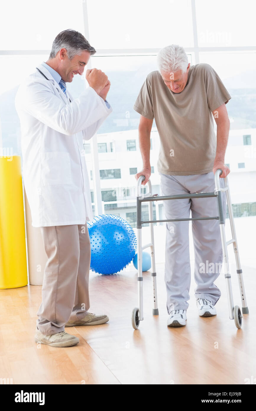 Elderly man walking zimmer frame hi-res stock photography and images ...