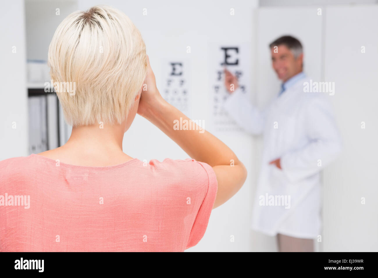 Woman reading eye test chart hi-res stock photography and images - Alamy