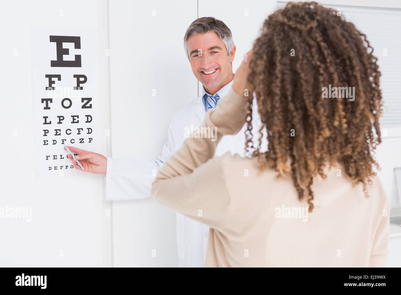 Woman reading eye test chart hi-res stock photography and images - Alamy