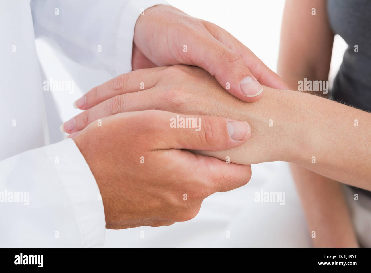 Doctor examining his patient hand Stock Photo - Alamy