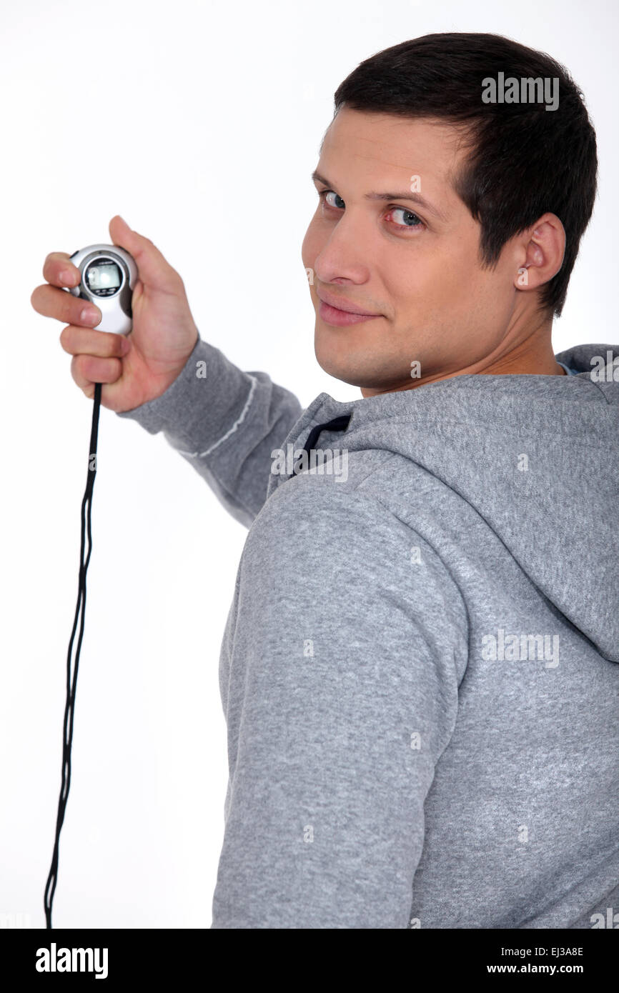 Sporty man with a stopwatch Stock Photo - Alamy