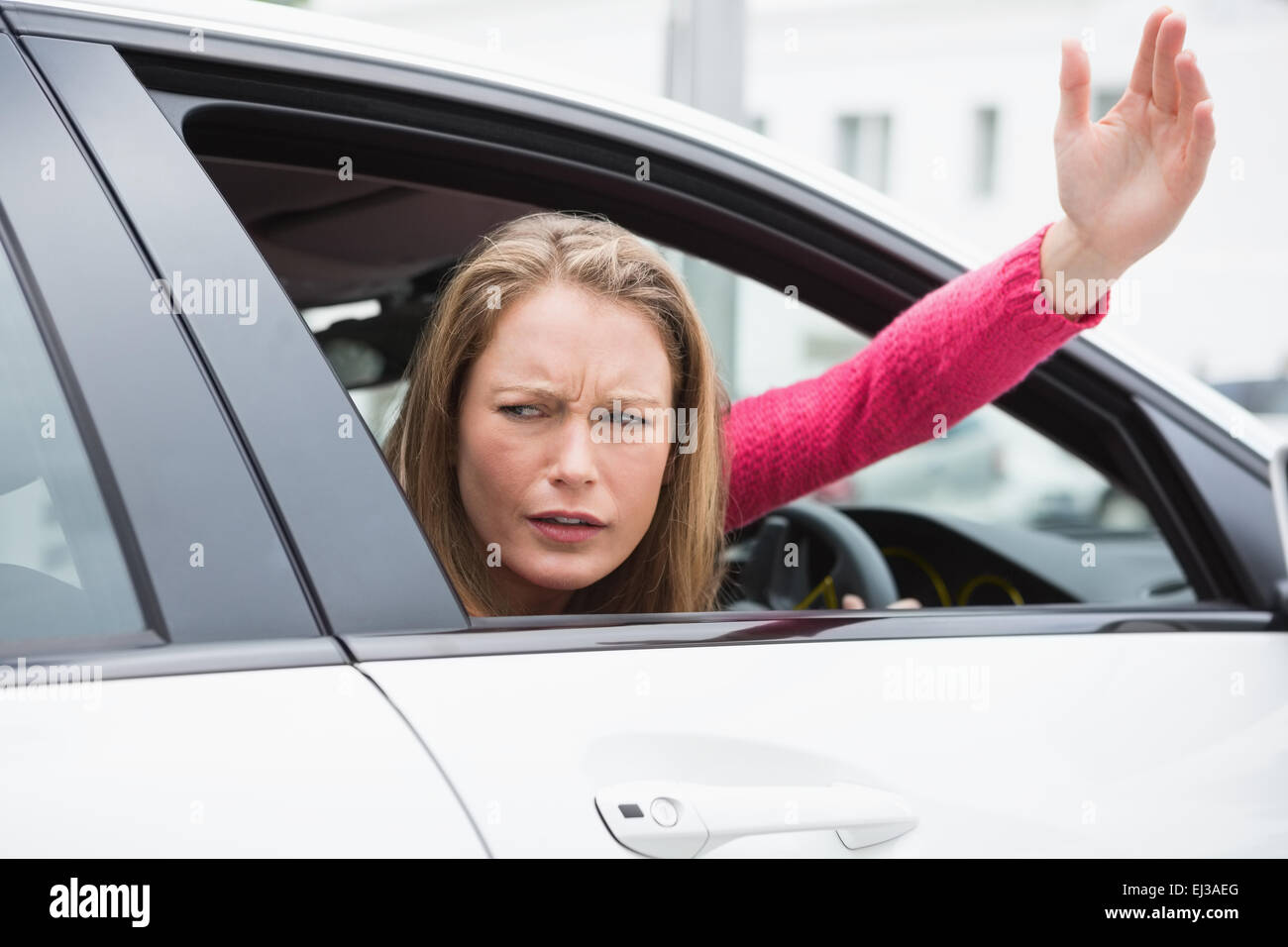 Young woman experiencing road rage Stock Photo - Alamy