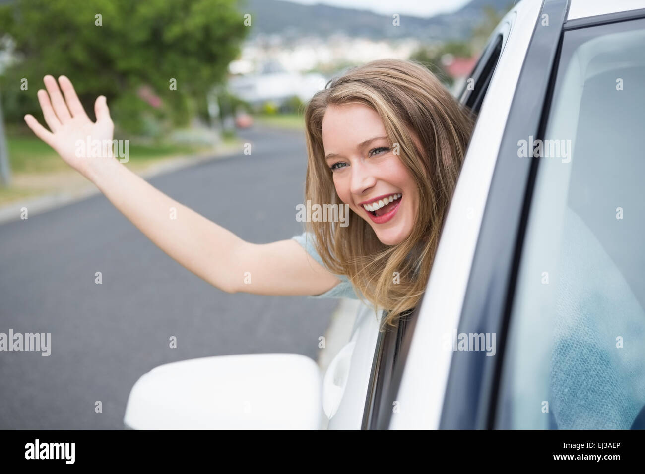 Waving woman hi-res stock photography and images - Alamy