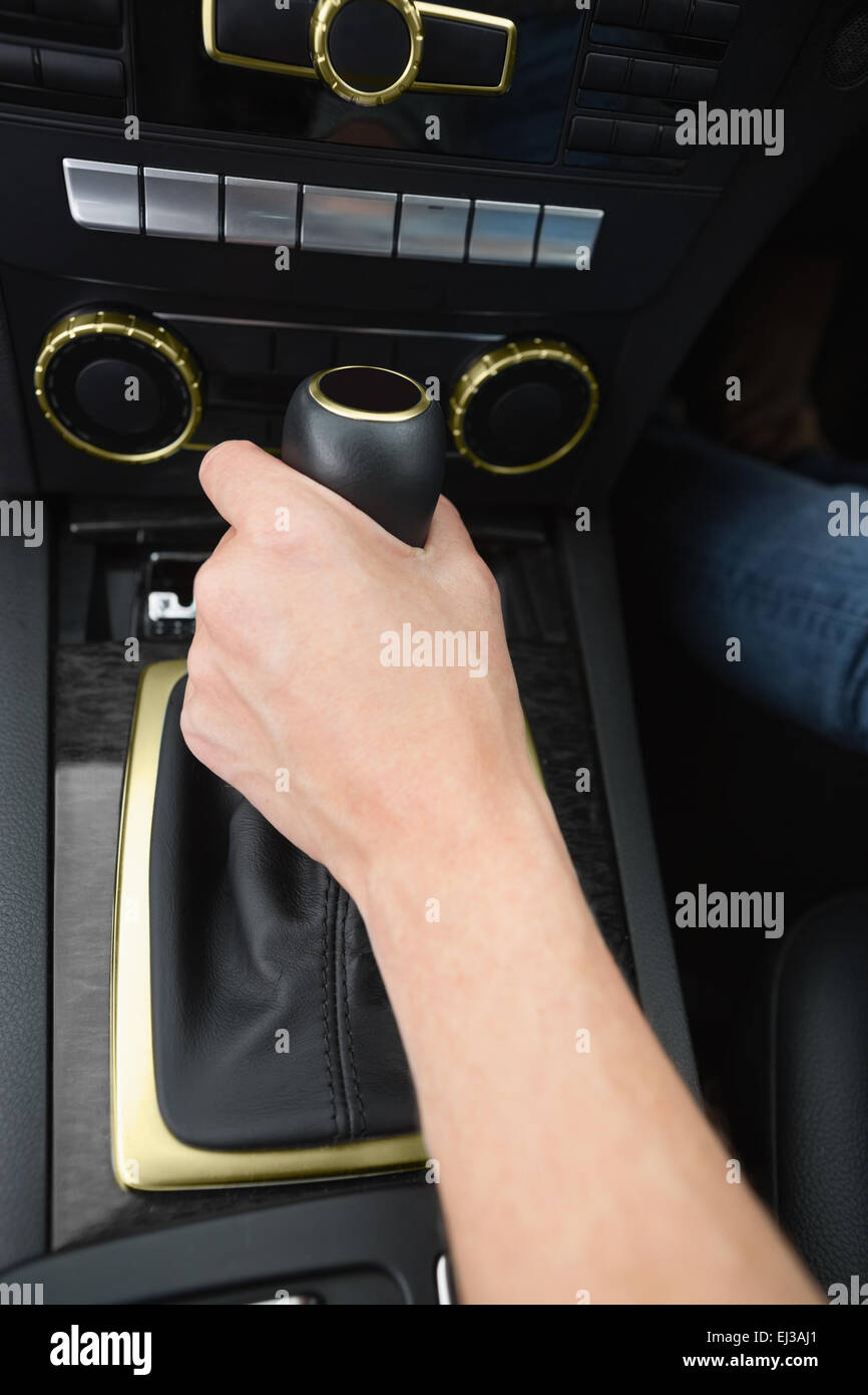 Woman using gearshift Stock Photo - Alamy