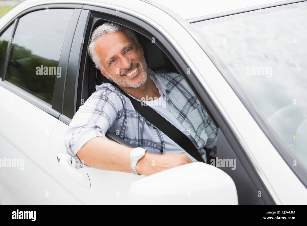 Man driving and smiling Stock Photo - Alamy