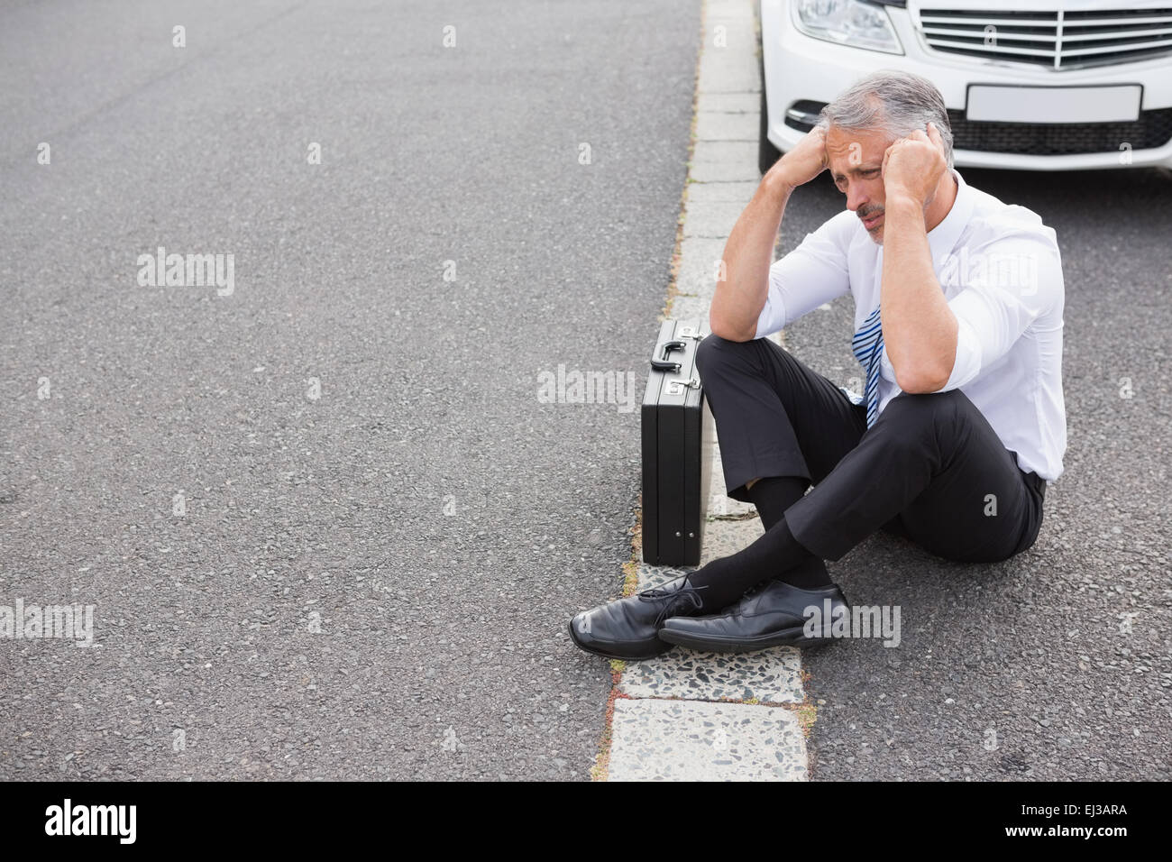 Sad man waiting for assistance after breaking down Stock Photo - Alamy
