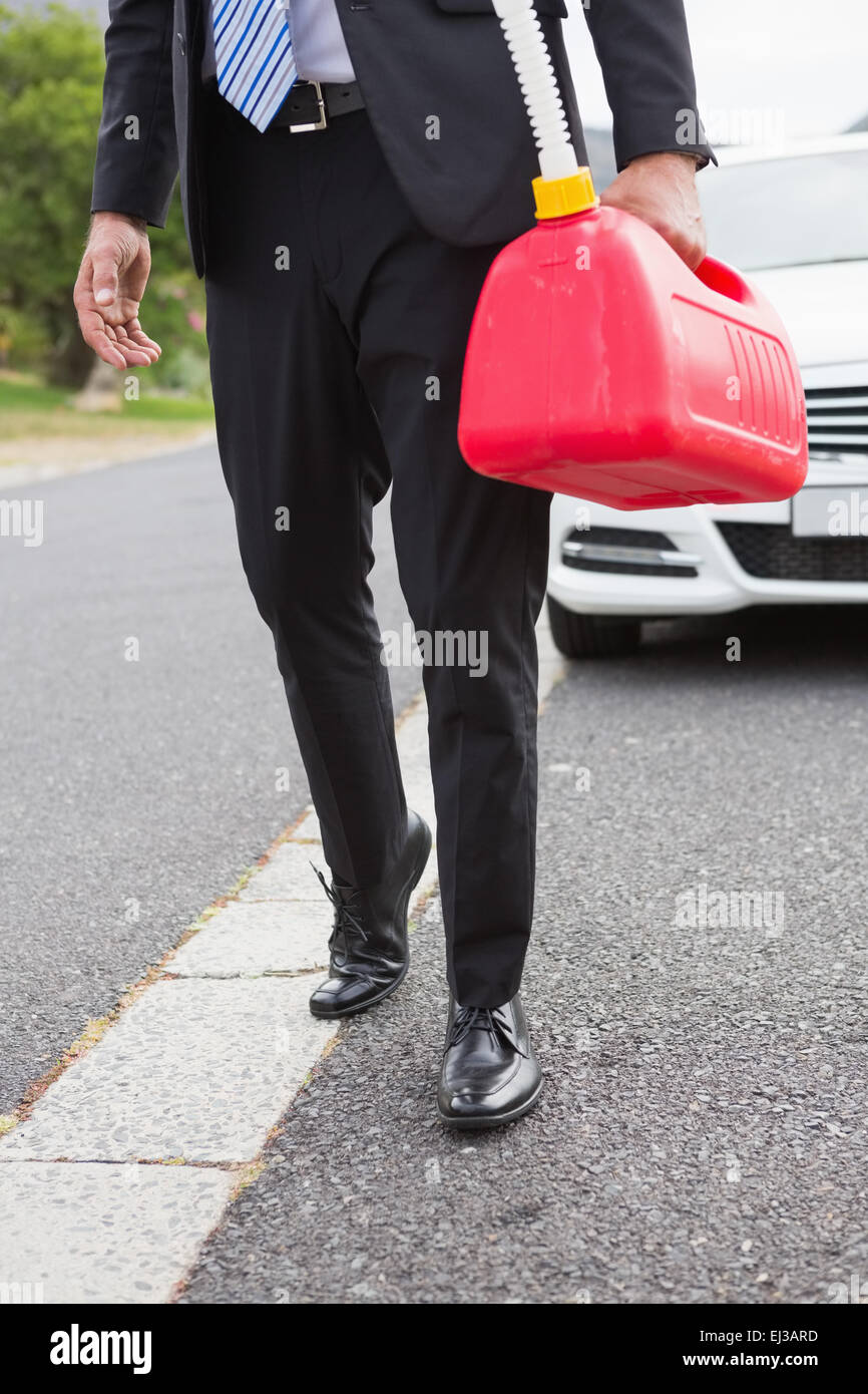 Man bringing petrol canister after broken down Stock Photo - Alamy