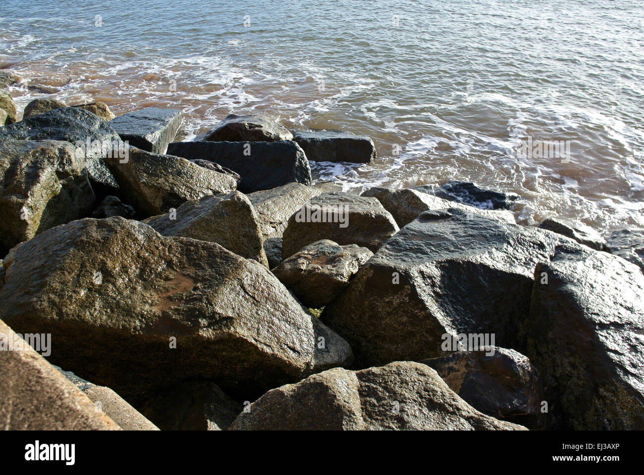 Sea over large rocks Stock Photo - Alamy