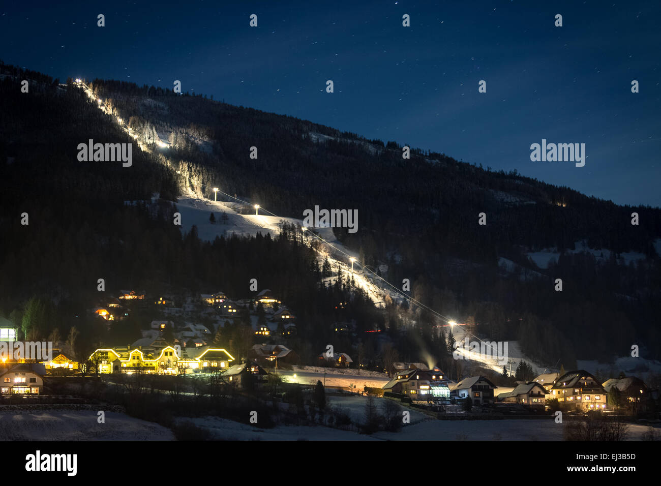 Long illuminated ski slope at Austrian Alps at starry night Stock Photo ...