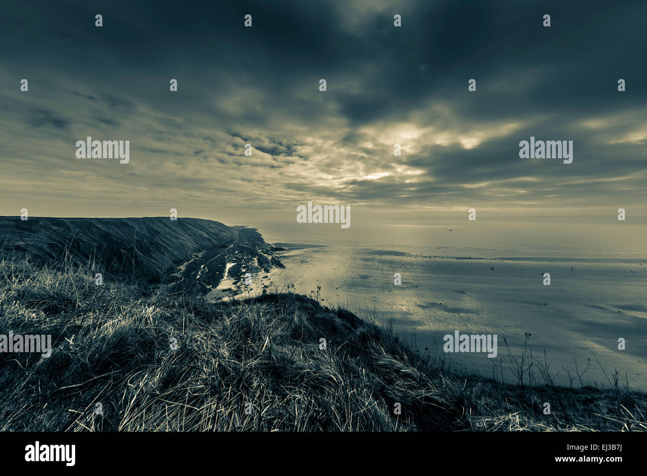 Sun rising at Filey Brigg, Yorkshire, UK Stock Photo - Alamy