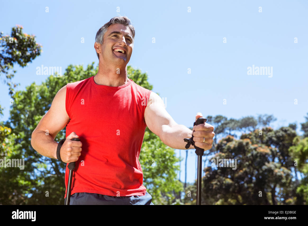 Fit man hiking in the park Stock Photo - Alamy