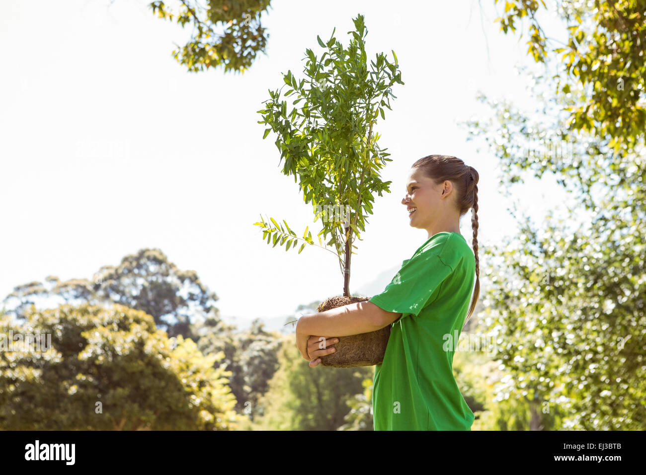 Environmental activist about to plant tree Stock Photo - Alamy
