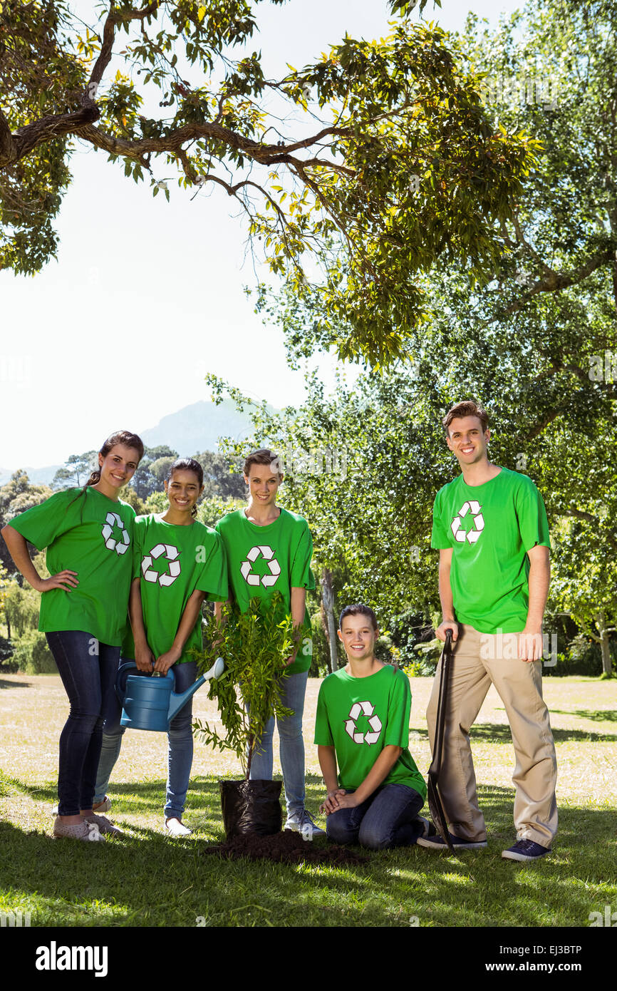 Environmental activists planting a tree in the park Stock Photo - Alamy