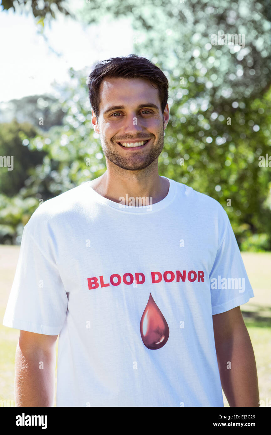 Blood donor smiling at camera Stock Photo - Alamy